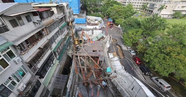 Ground under tilted buildings near Taipei construction site being ...
